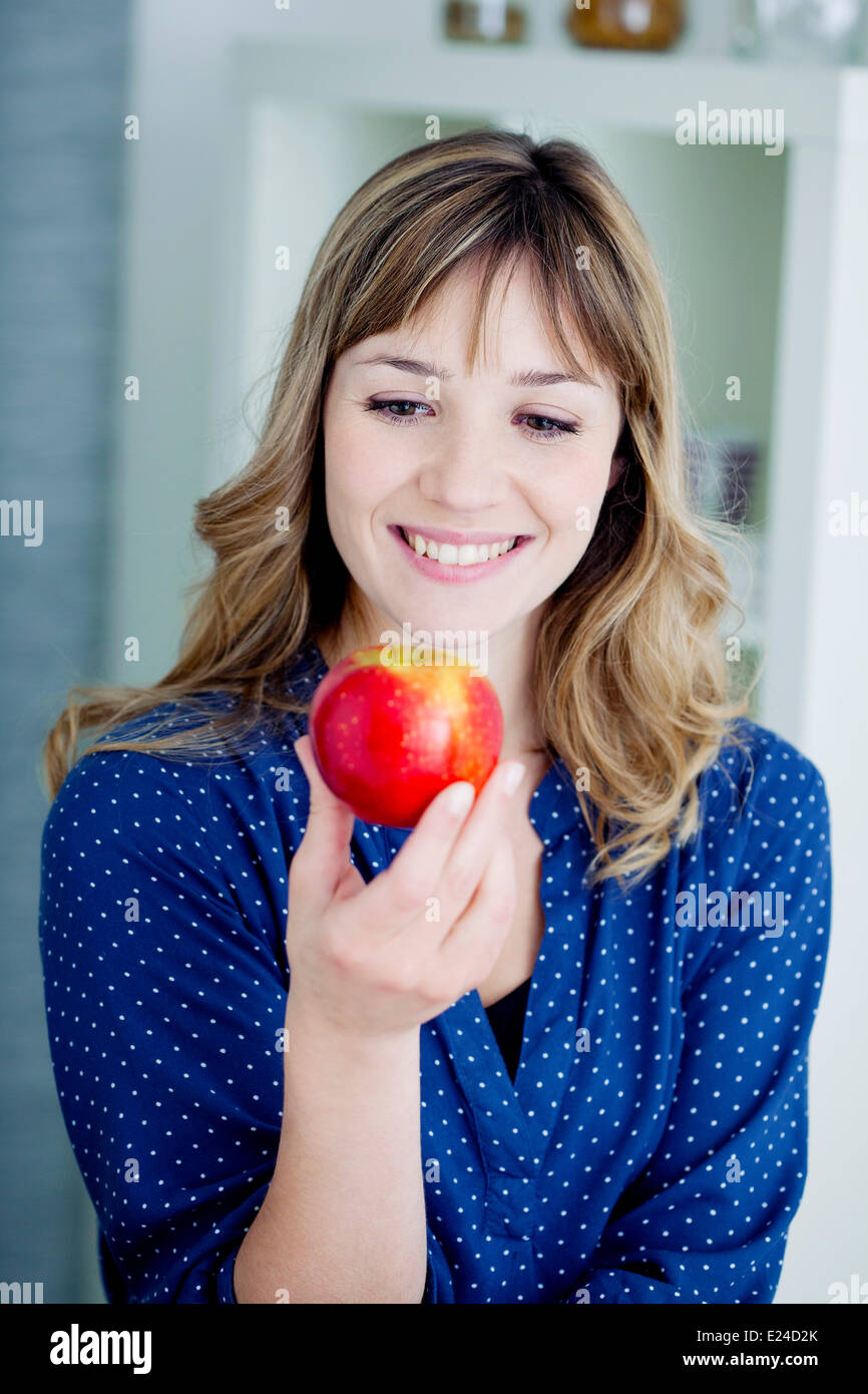 Woman eating fruit Stock Photo - Alamy