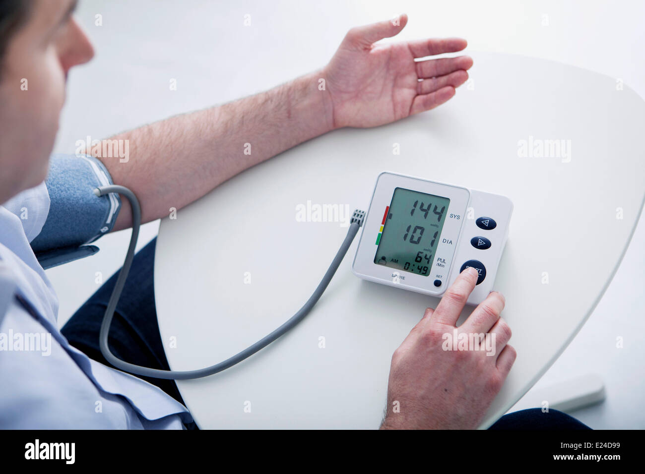 Blood pressure, man Stock Photo - Alamy