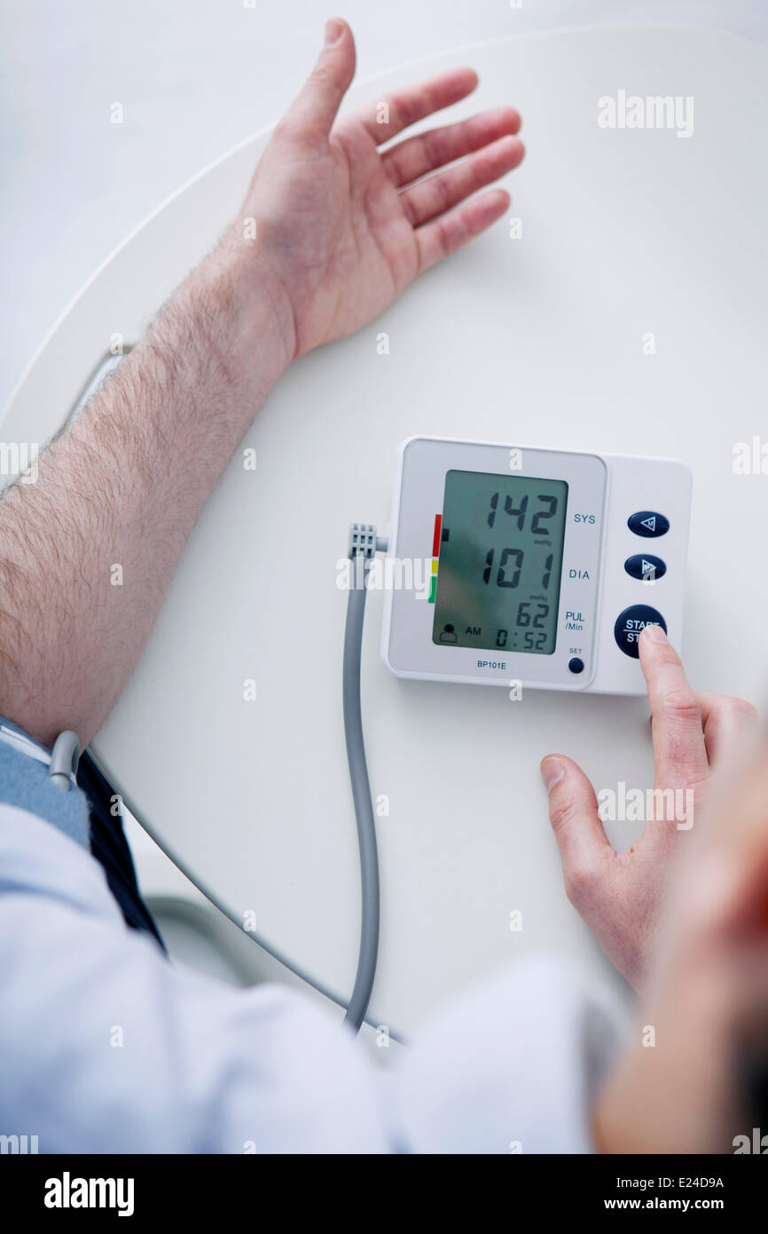 Blood pressure, man Stock Photo - Alamy