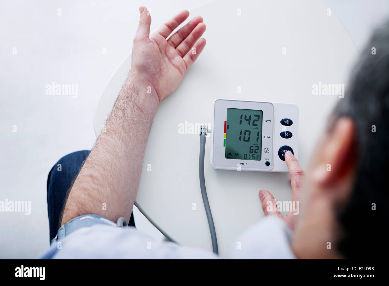 Blood pressure, man Stock Photo - Alamy