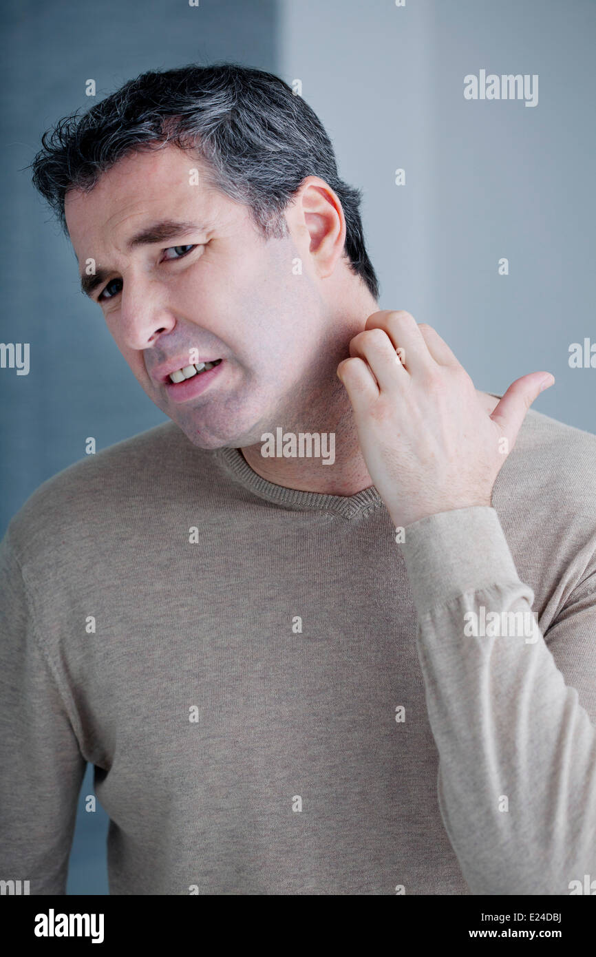 Itching in a man Stock Photo - Alamy