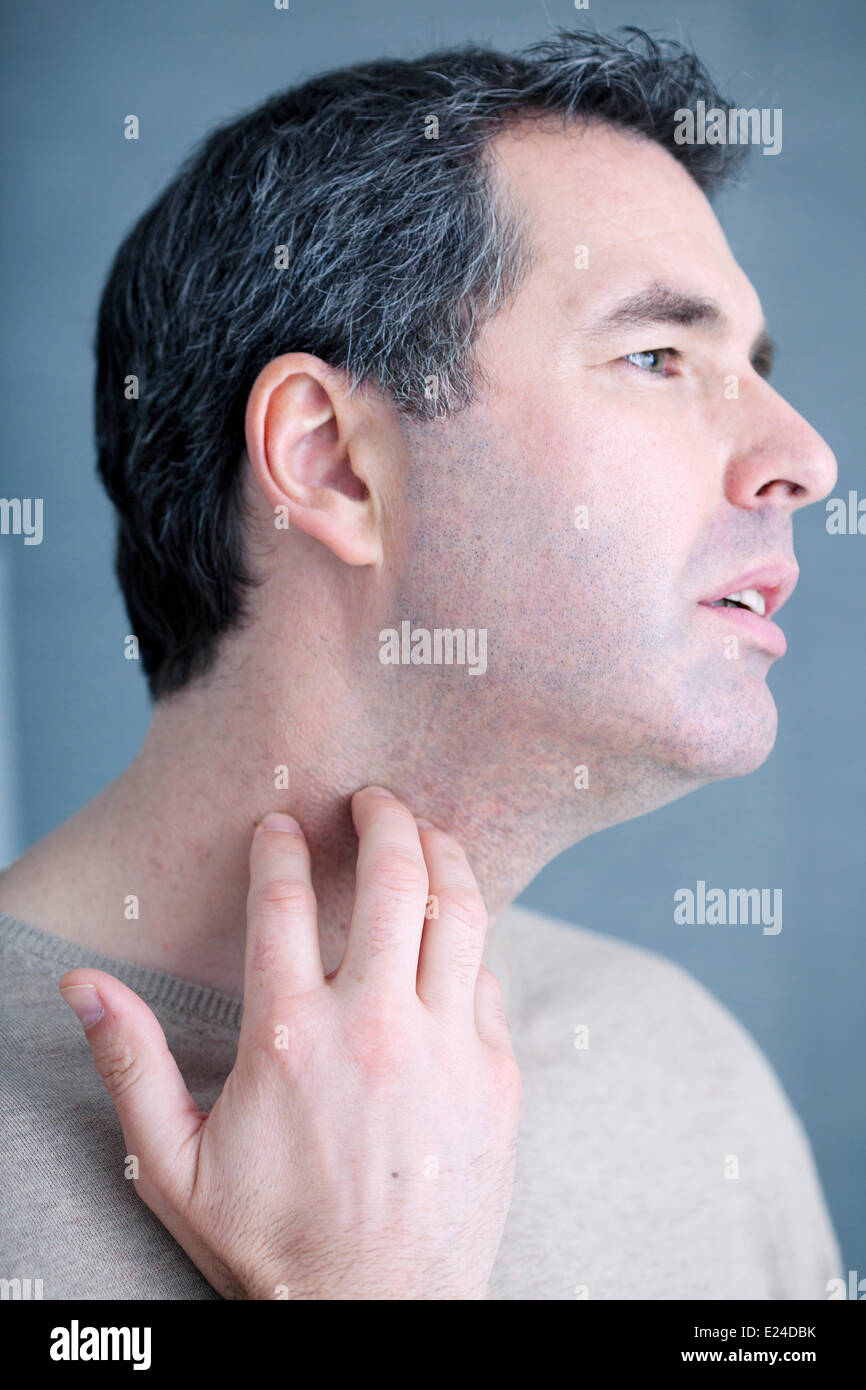 Itching in a man Stock Photo - Alamy
