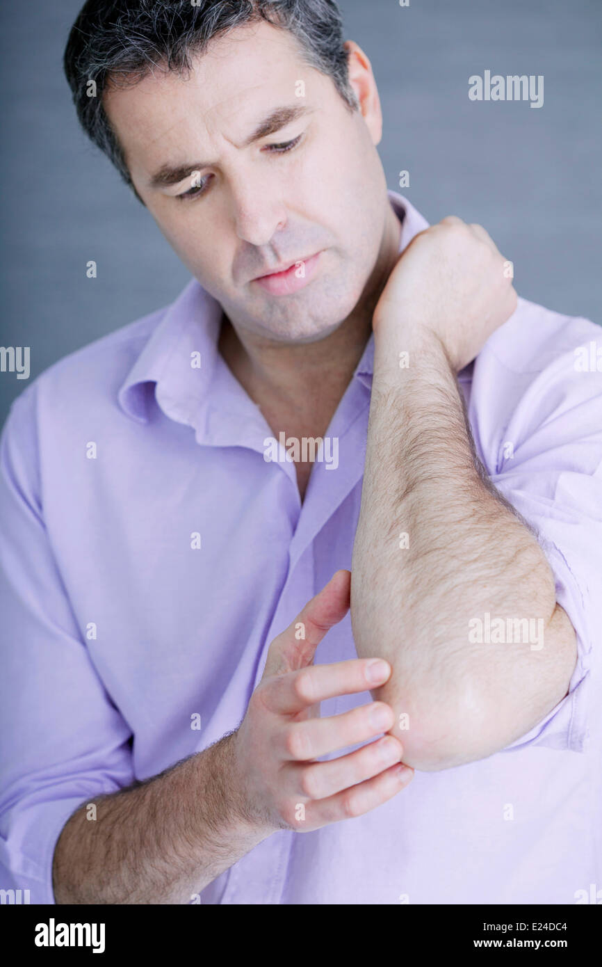 Itching in a man Stock Photo - Alamy