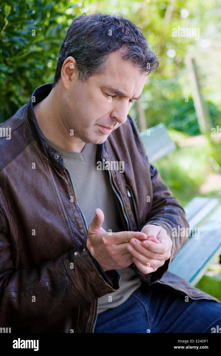Man with painful hand Stock Photo - Alamy