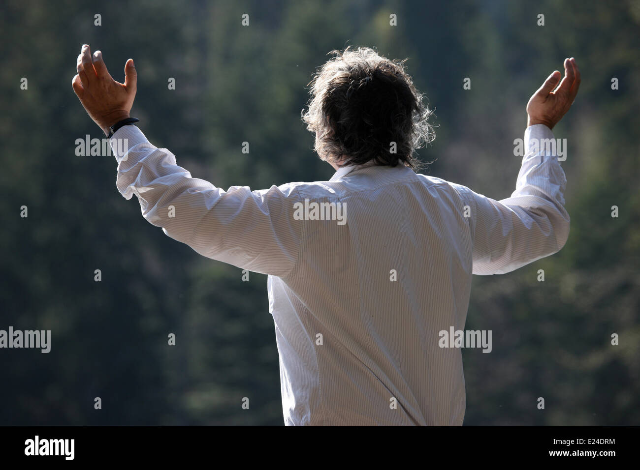 Man raising his arms Stock Photo - Alamy