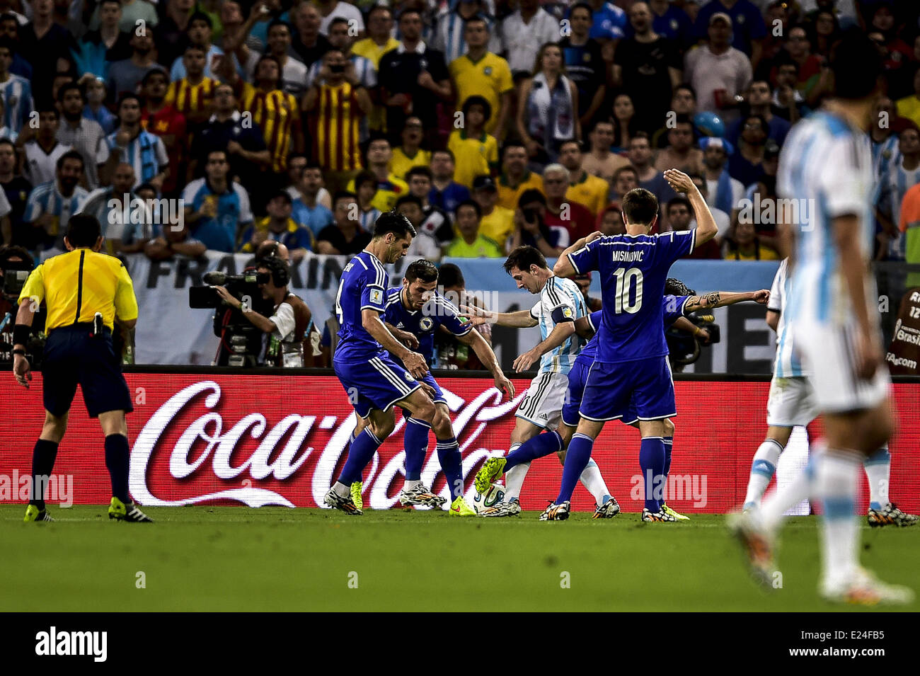 Rio De Janeiro, Brazil. 15th June, 2014. Lionel Messi plays surrounded ...