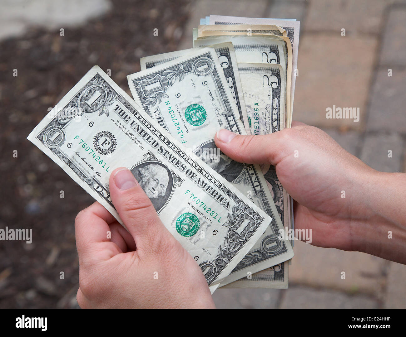 Us dollar notes hand hi-res stock photography and images - Alamy