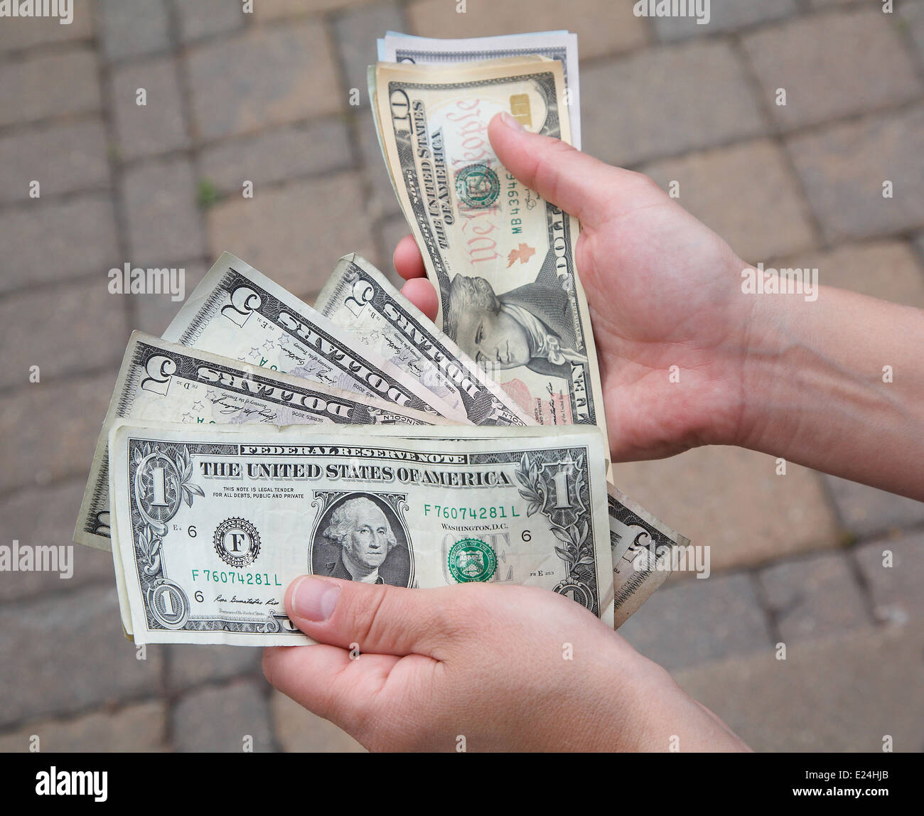 Hands counting money dollar bills hi-res stock photography and images ...