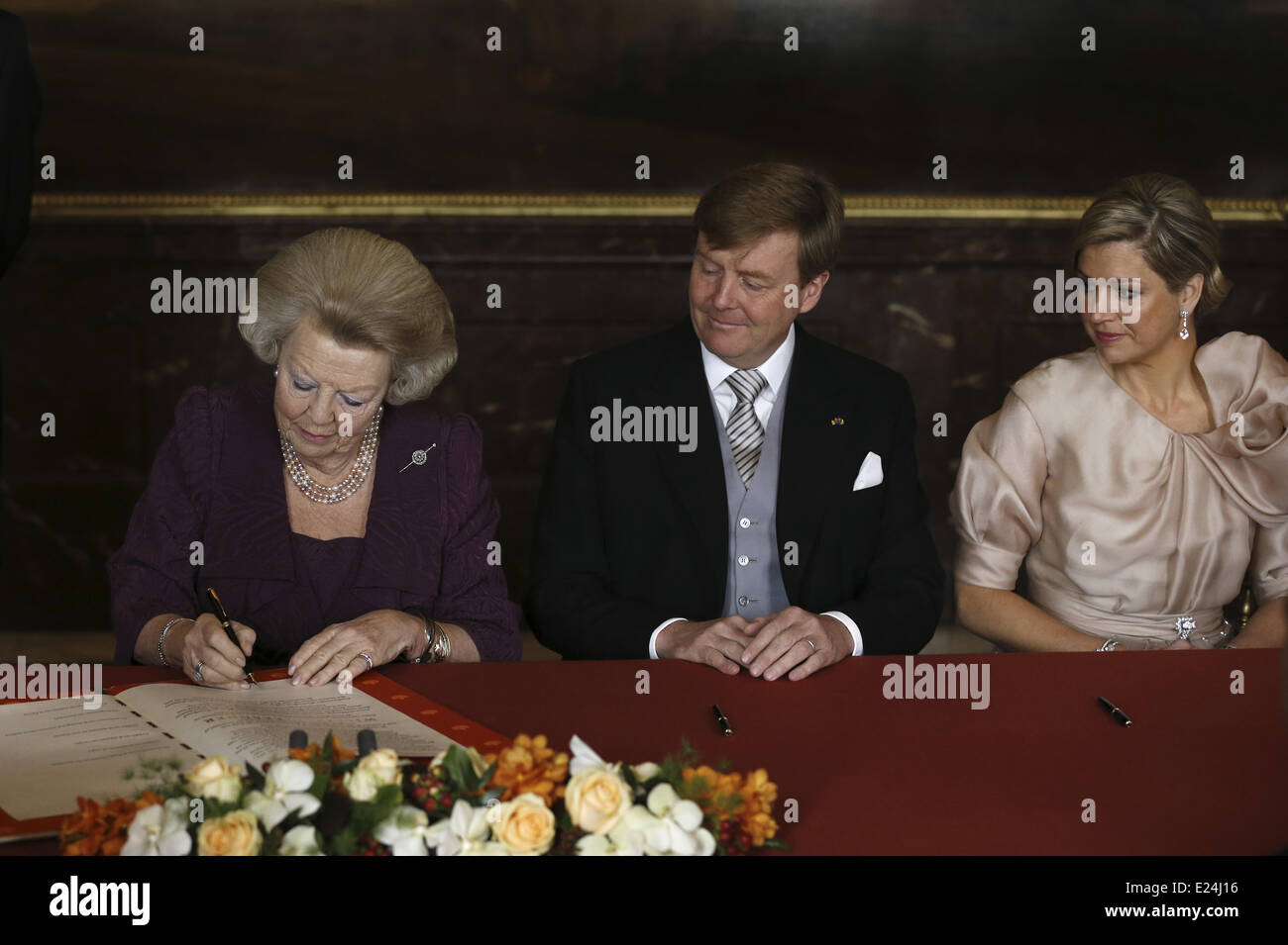 Queen Beatrix signs the Act of Abdication in favour of her son, Prince ...