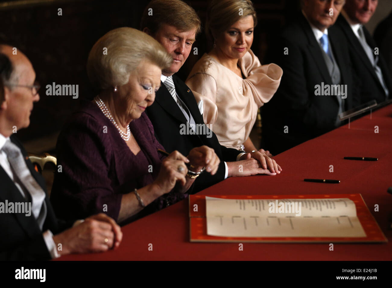Queen Beatrix signs the Act of Abdication in favour of her son, Prince ...