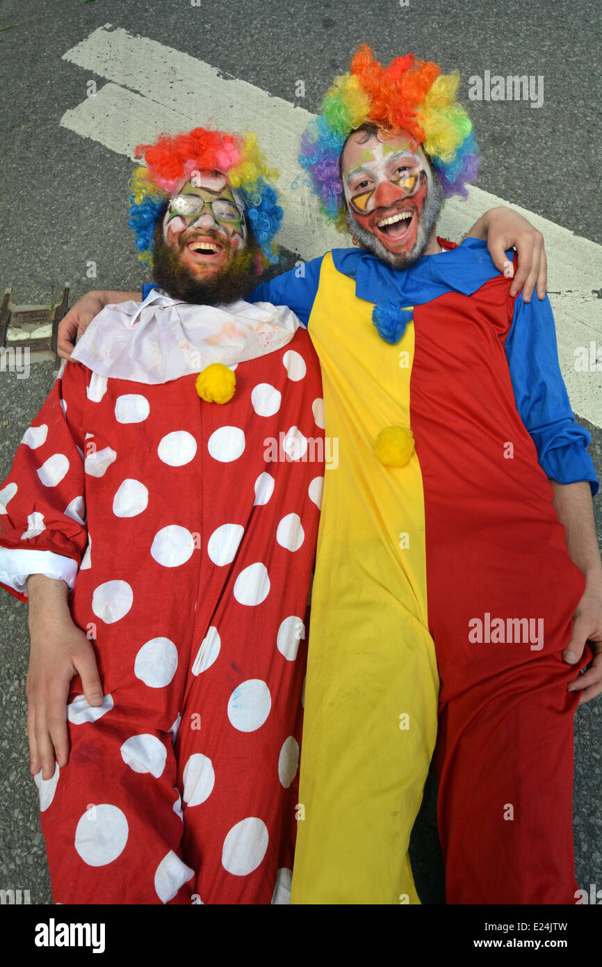 2 religious Jewish men dressed as a clown at the Lag B'Omer parade in ...