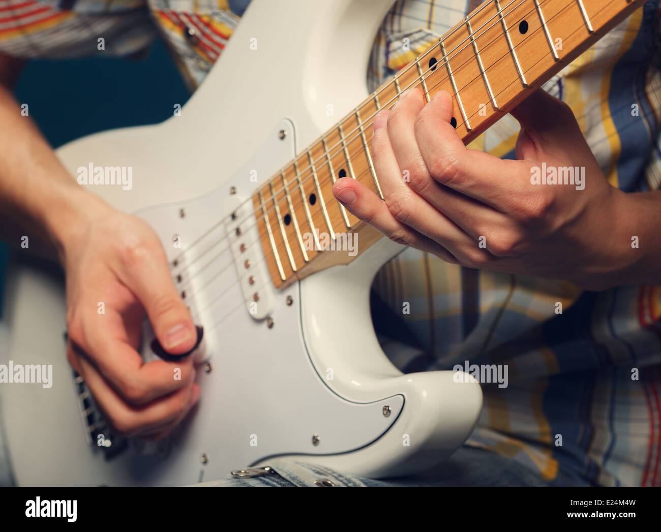 Guitarist playing an electric guitar Stock Photo - Alamy