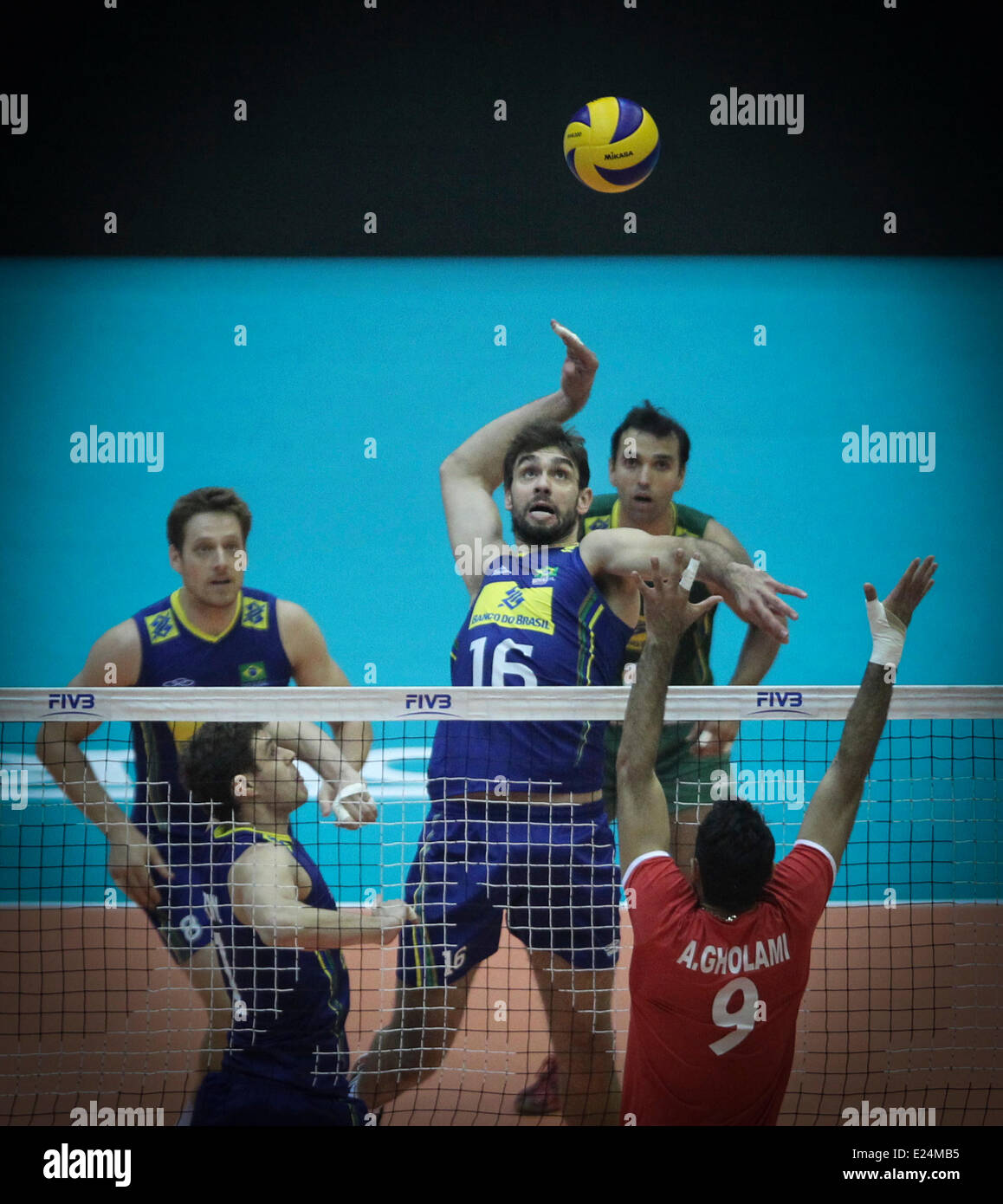 Tehran, Iran. 15th June, 2014. Lucas Satkamp (top) of Brazil spikes the ...