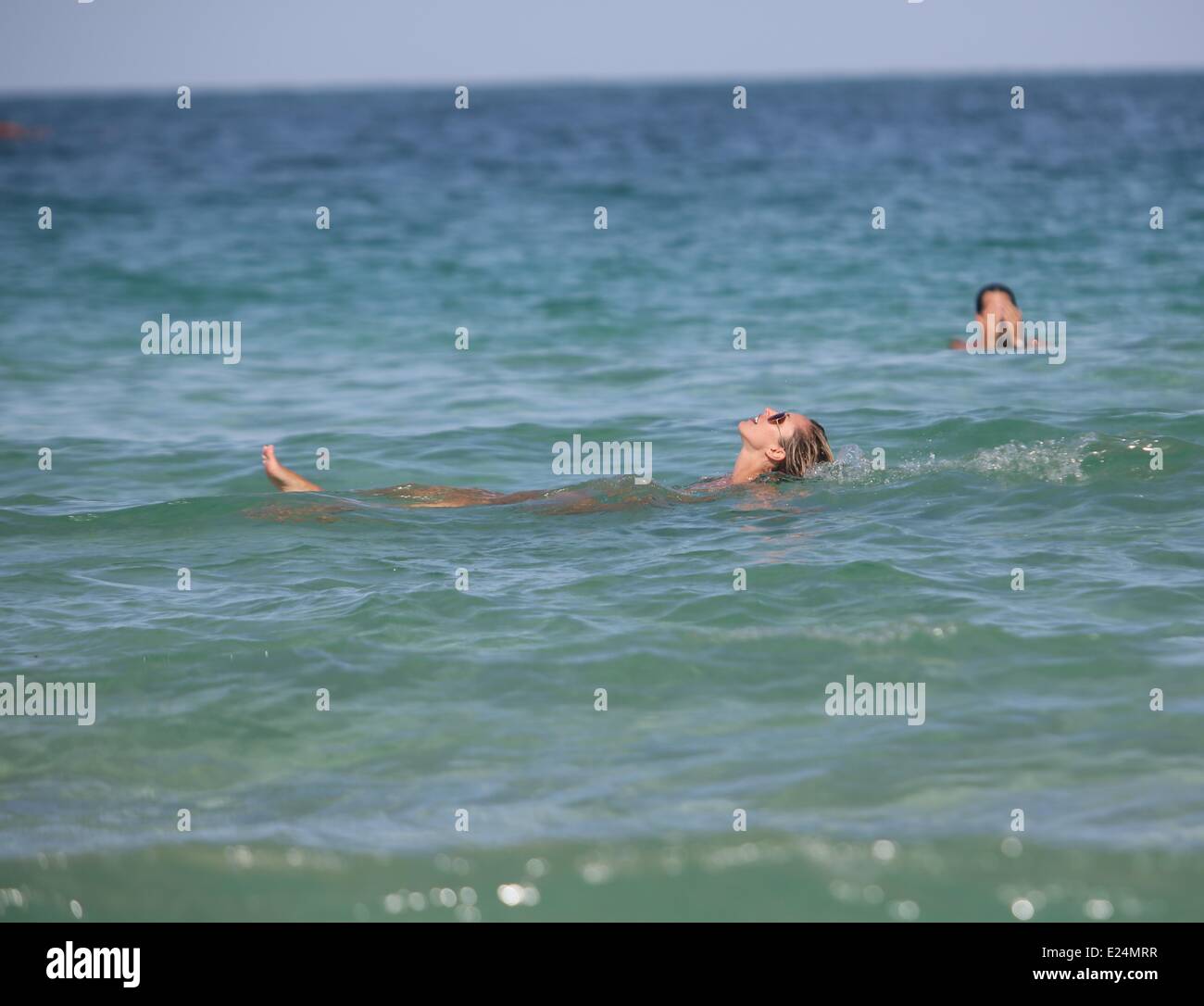 Lauren Stoner shows her bikini body in the warm Miami sun. Miami Beach ...