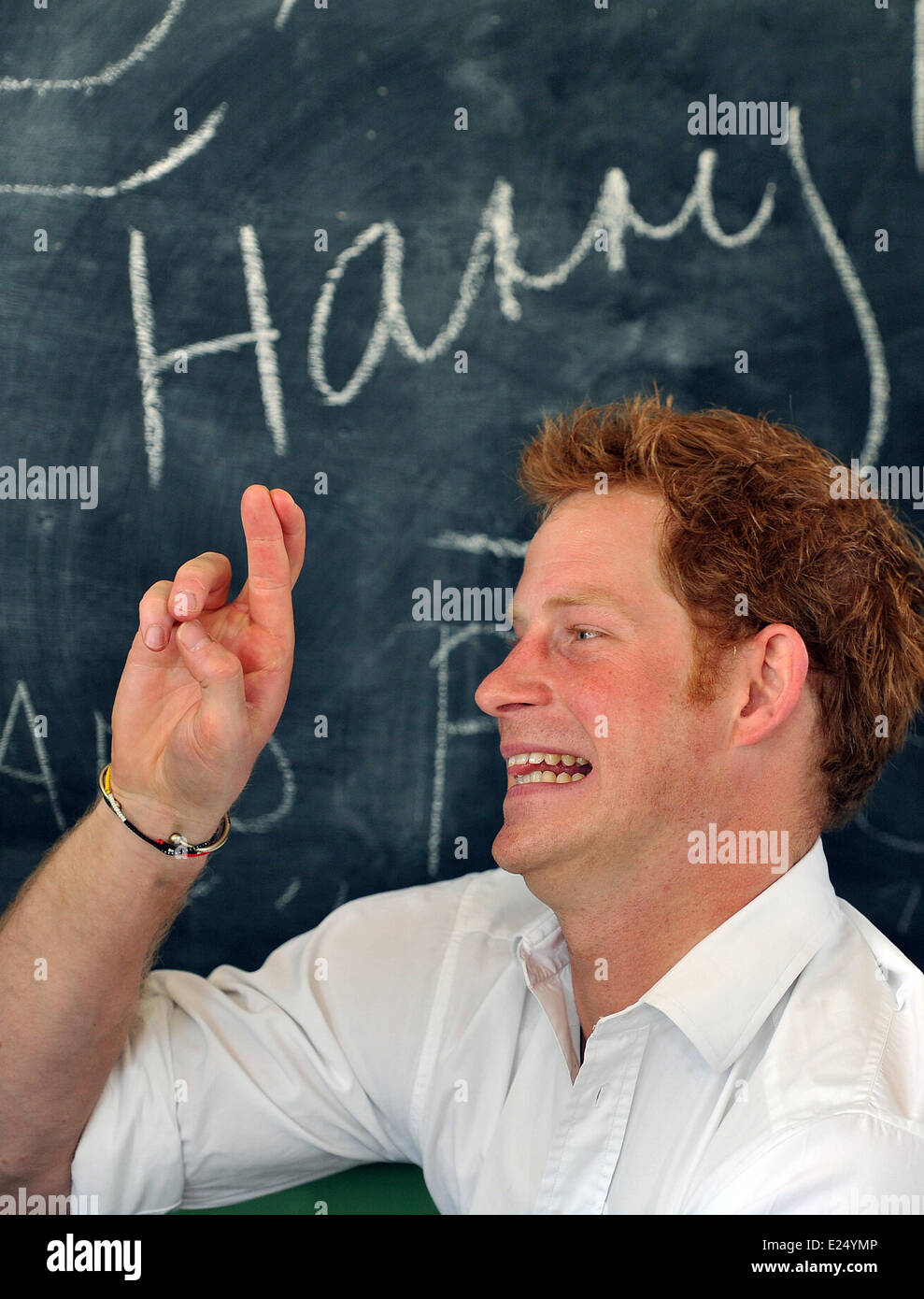 Prince Harry tries his hand at sign sign language in a class at the ...