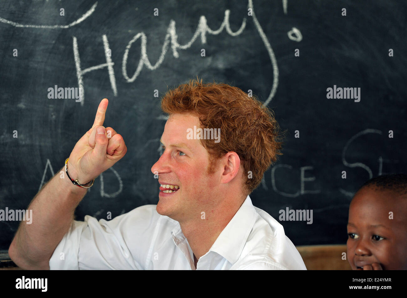 Prince Harry tries his hand at sign sign language in a class at the ...