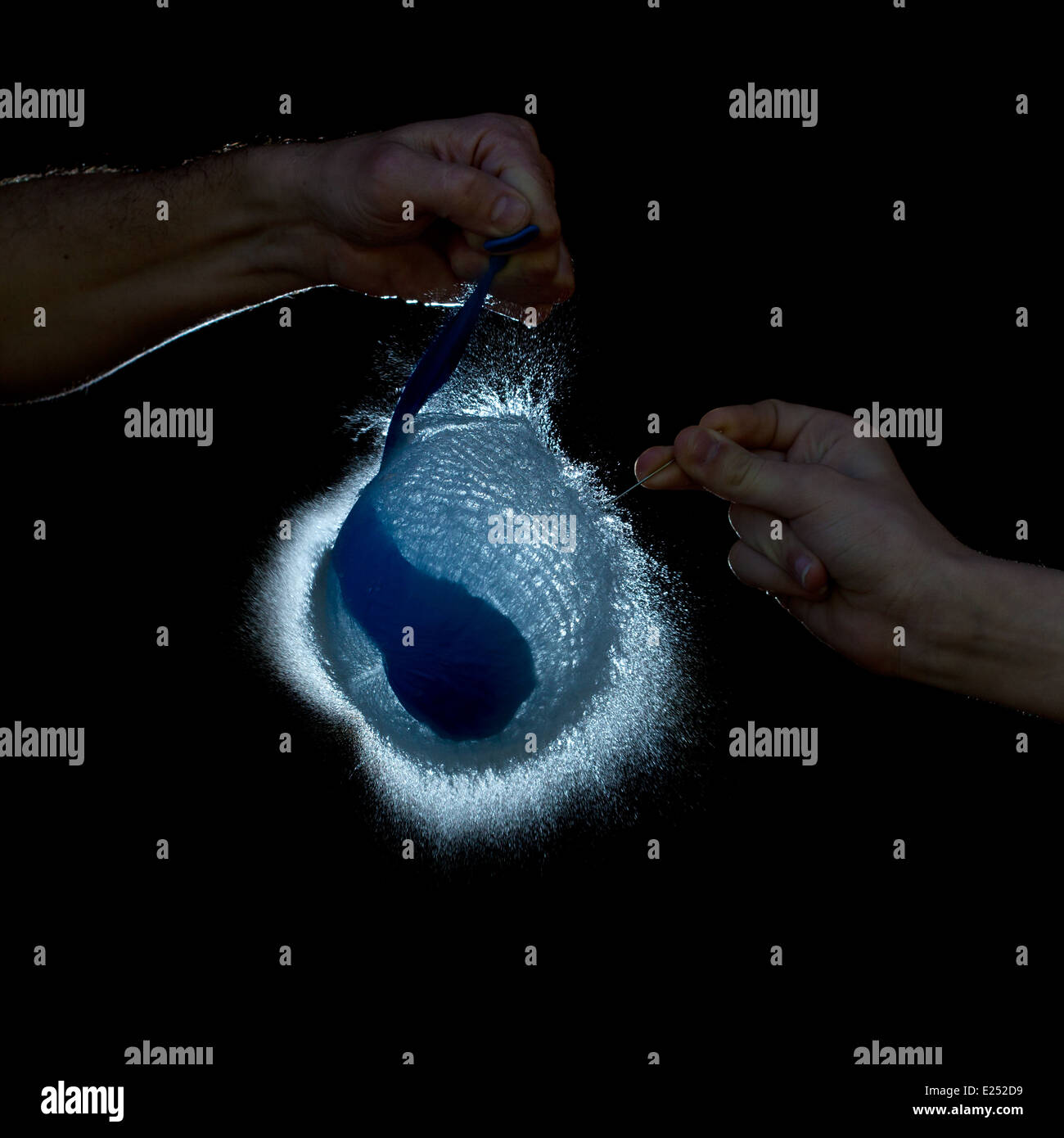 water balloon bursting on black background Stock Photo - Alamy