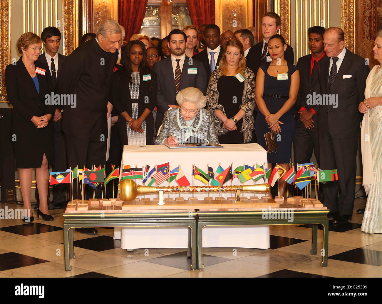 Queen Elizabeth II, Head of the Commonwealth signs the Commonwealth ...