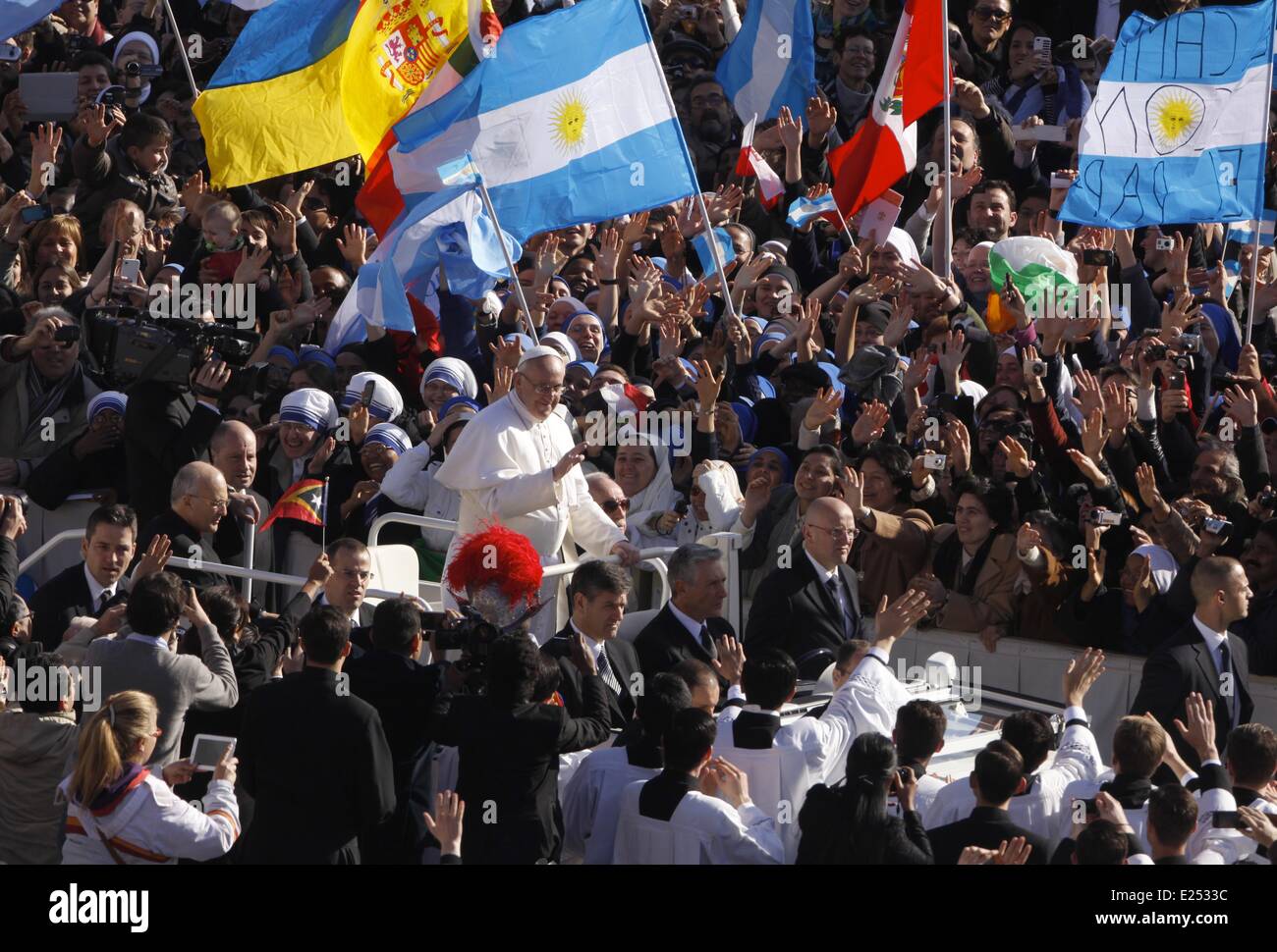 Pope Francis waves to the crowd from the papalmobile during his ...