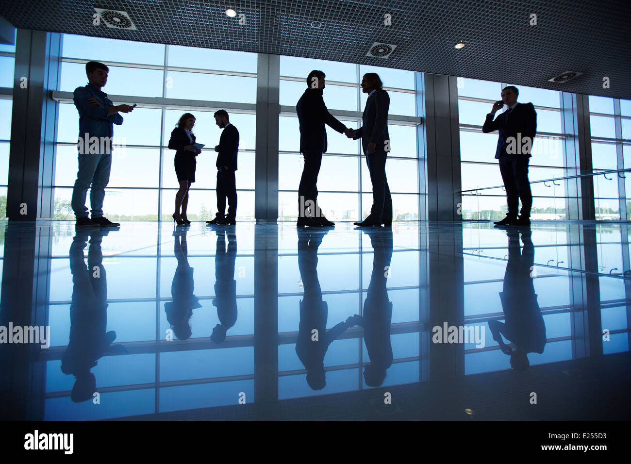 Silhouettes of several office workers working in office Stock Photo - Alamy