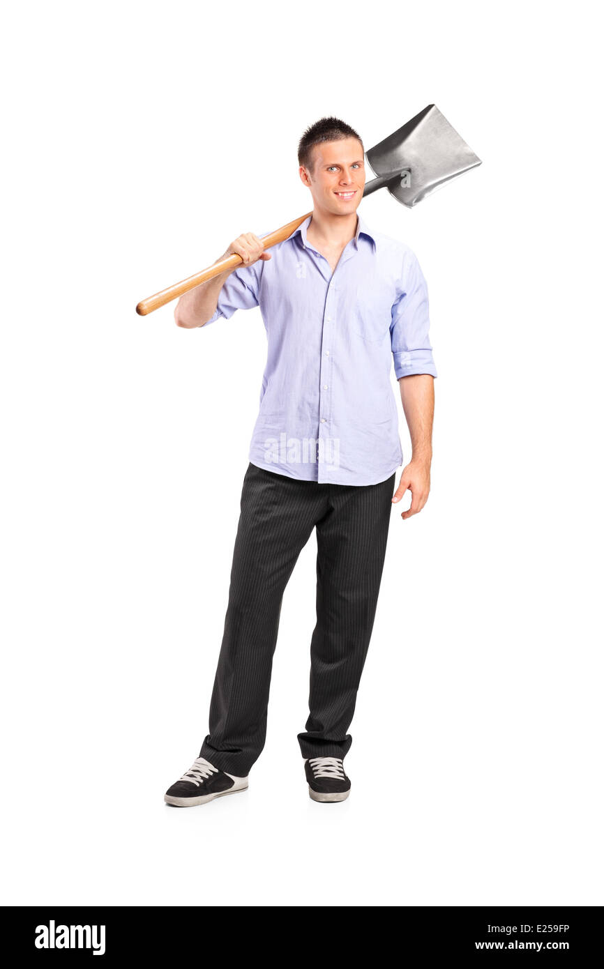 Full length portrait of a young man holding a shovel Stock Photo - Alamy