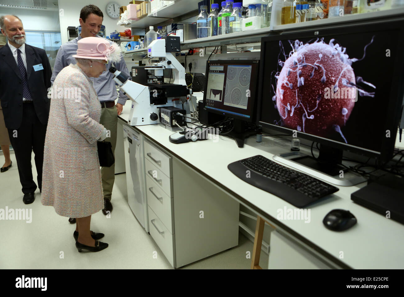 CAMBRIDGE - UK -23 MAY 2013: ROTA: Queen Elizabeth II looks at mouse ...
