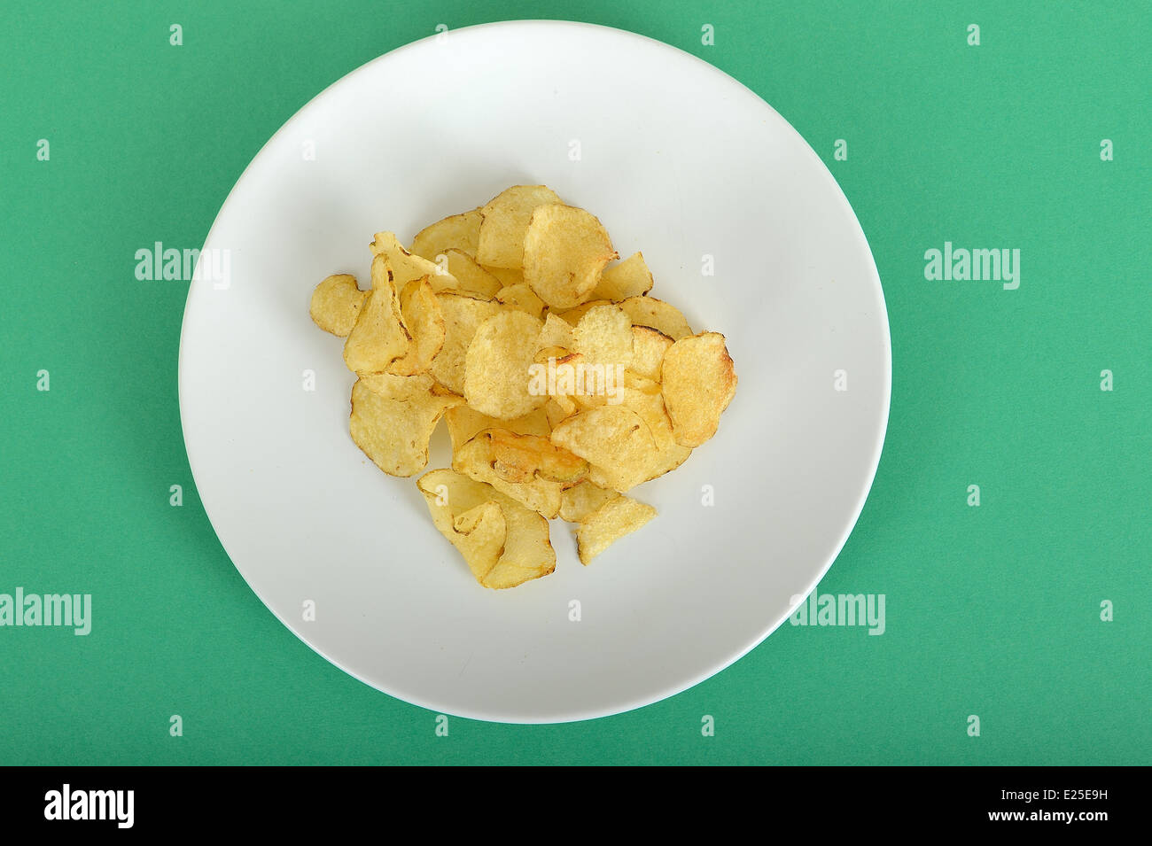 Handful of crisps hi-res stock photography and images - Alamy