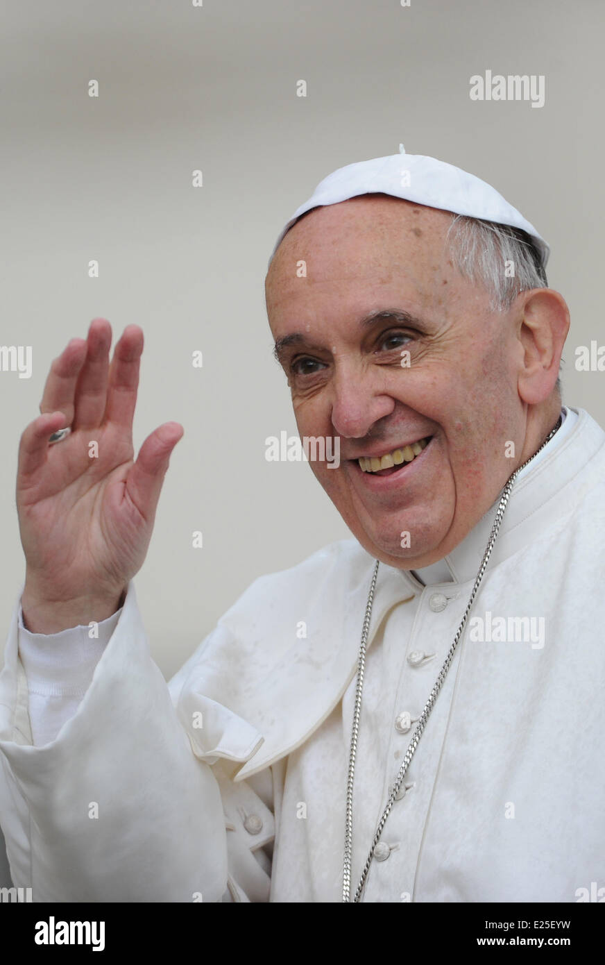 Pope Francis gets soaked as he braves rain to greet crowds during the ...