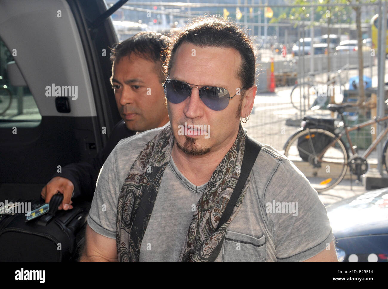 Paul Stanley and Eric Singer of Kiss arrive at their Stockholm hotel ...
