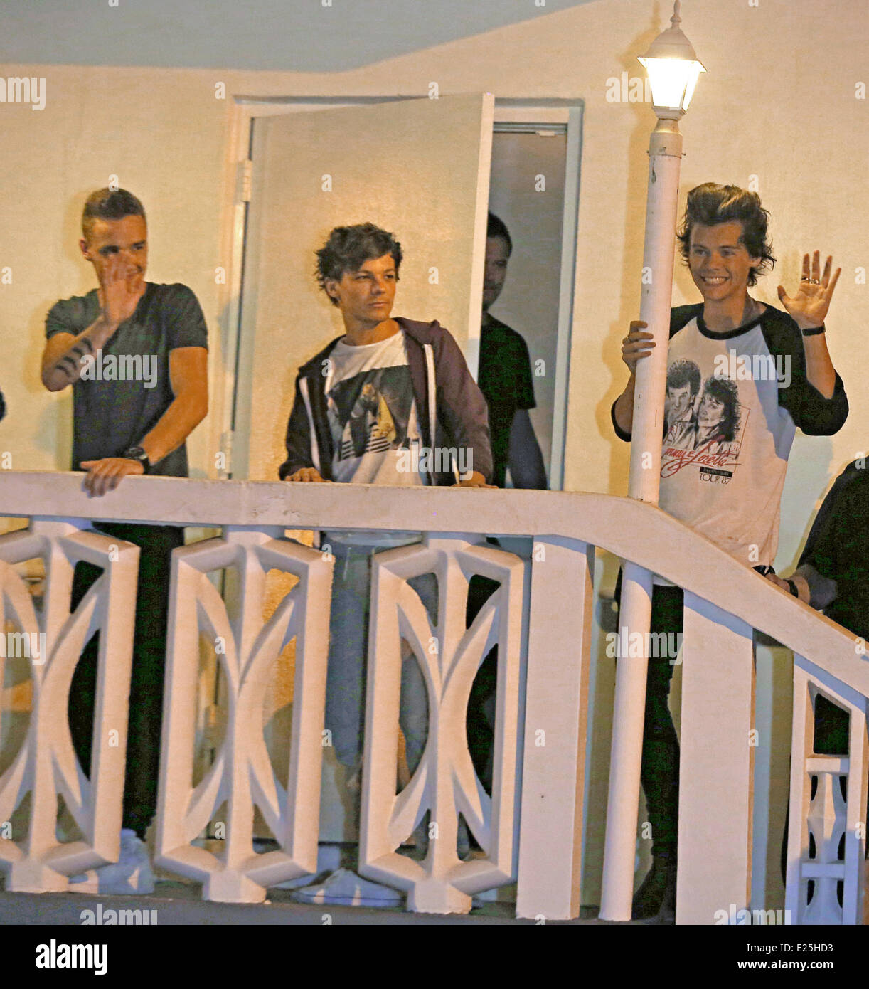 One Direction wave to fans on a balcony in Miami Featuring: Liam Payne ...