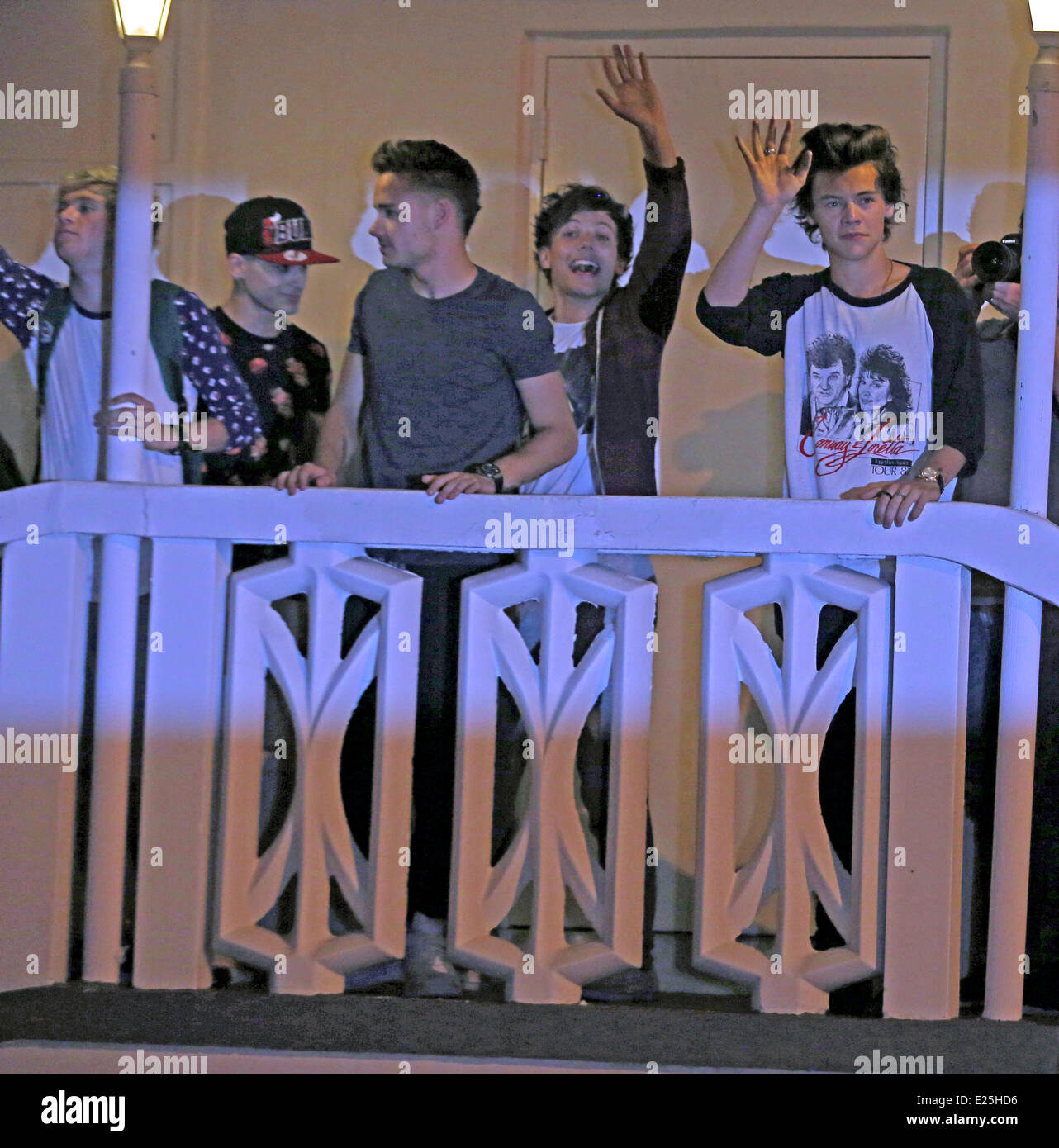 One Direction wave to fans on a balcony in Miami Featuring: Niall Horan ...