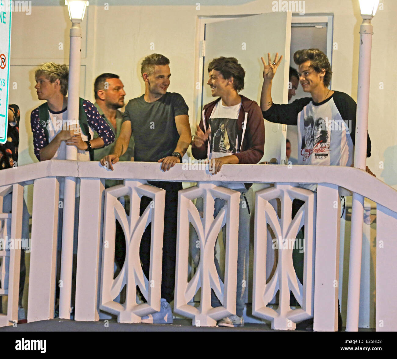 One Direction wave to fans on a balcony in Miami Featuring: Niall Horan ...