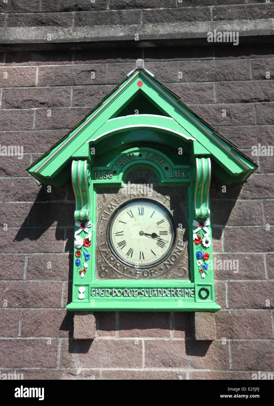 A clock at twenty past three in a carved wooden frame Stock Photo - Alamy