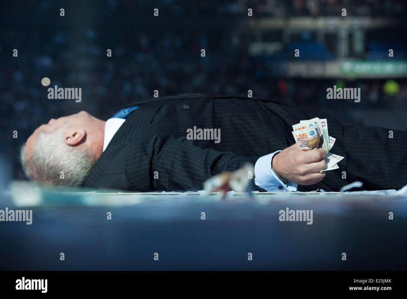 Muse perform live in concert at the Stade de France. An actor throws ...