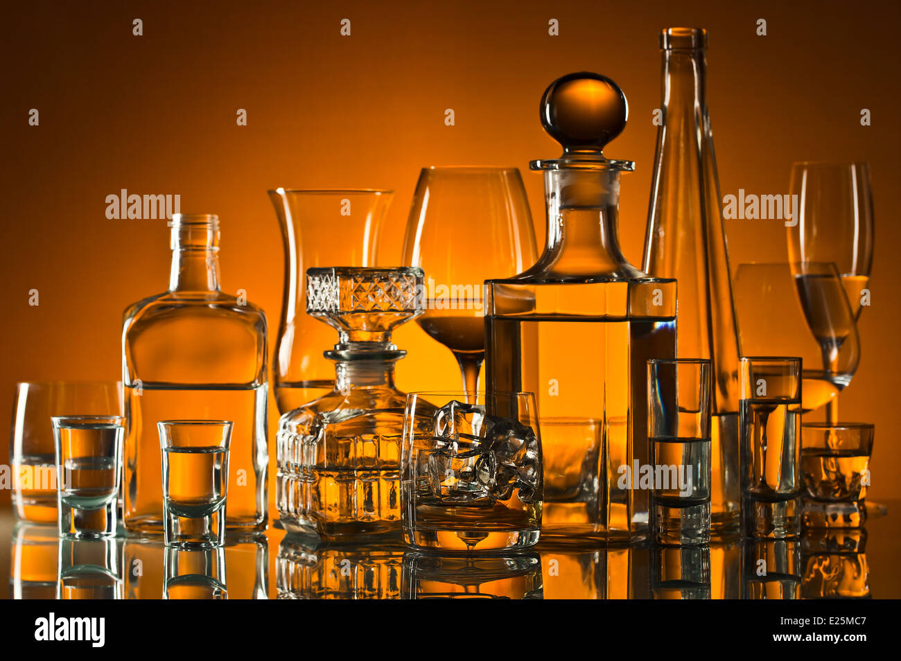 alcoholic drinks in bar on glass table Stock Photo - Alamy