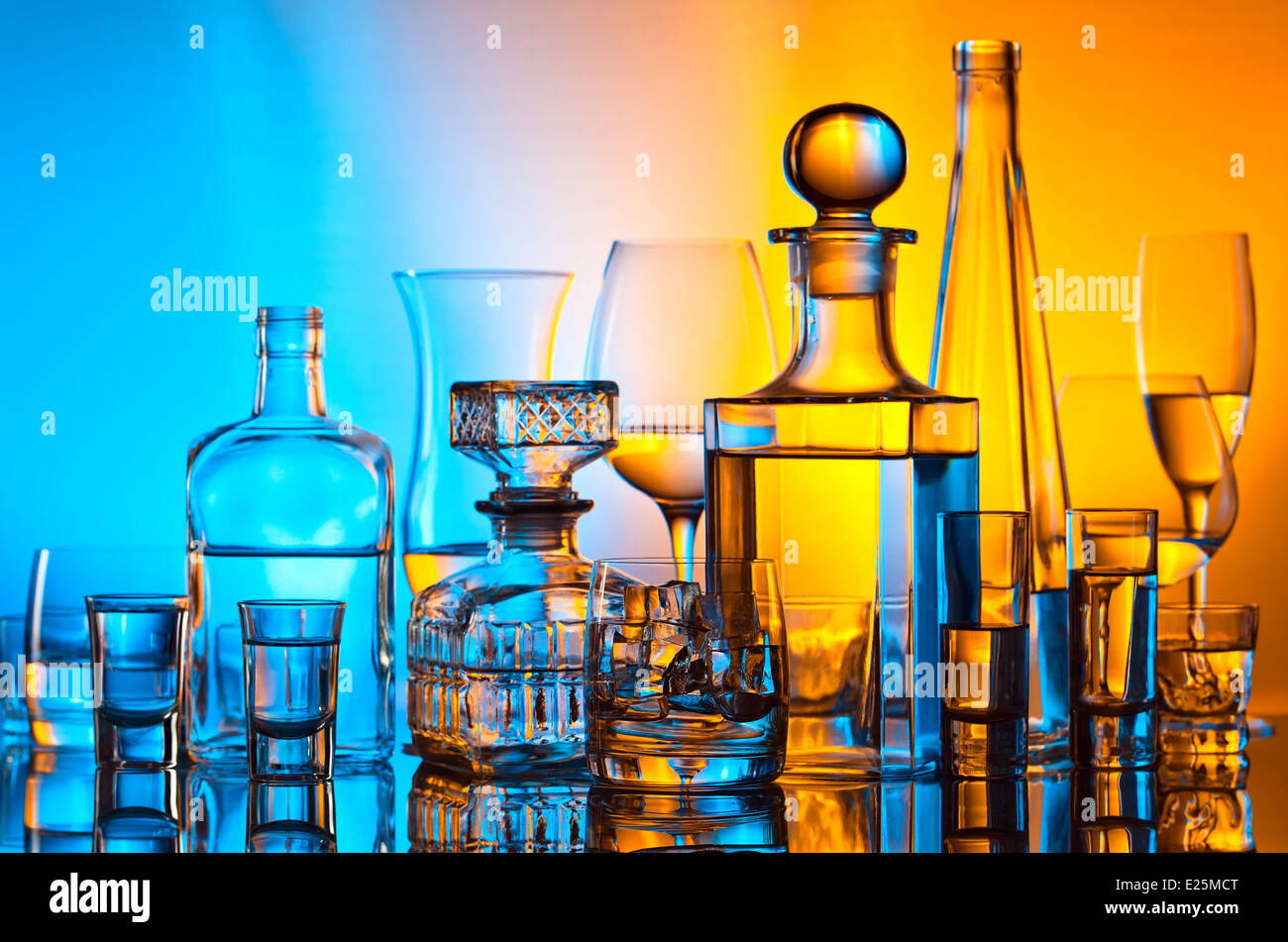 alcoholic drinks in bar on glass table Stock Photo - Alamy