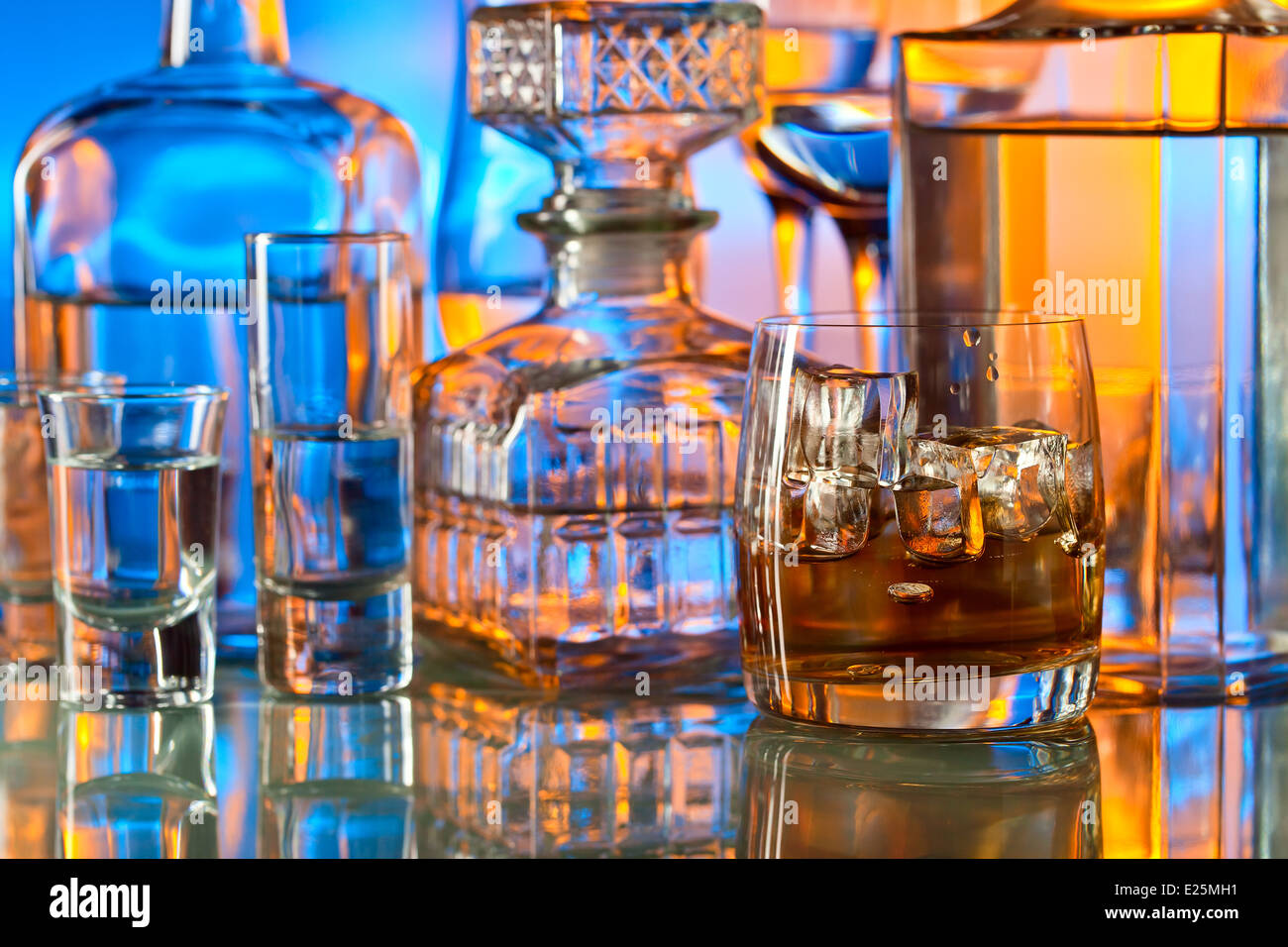 alcoholic drinks in bar on glass table Stock Photo - Alamy