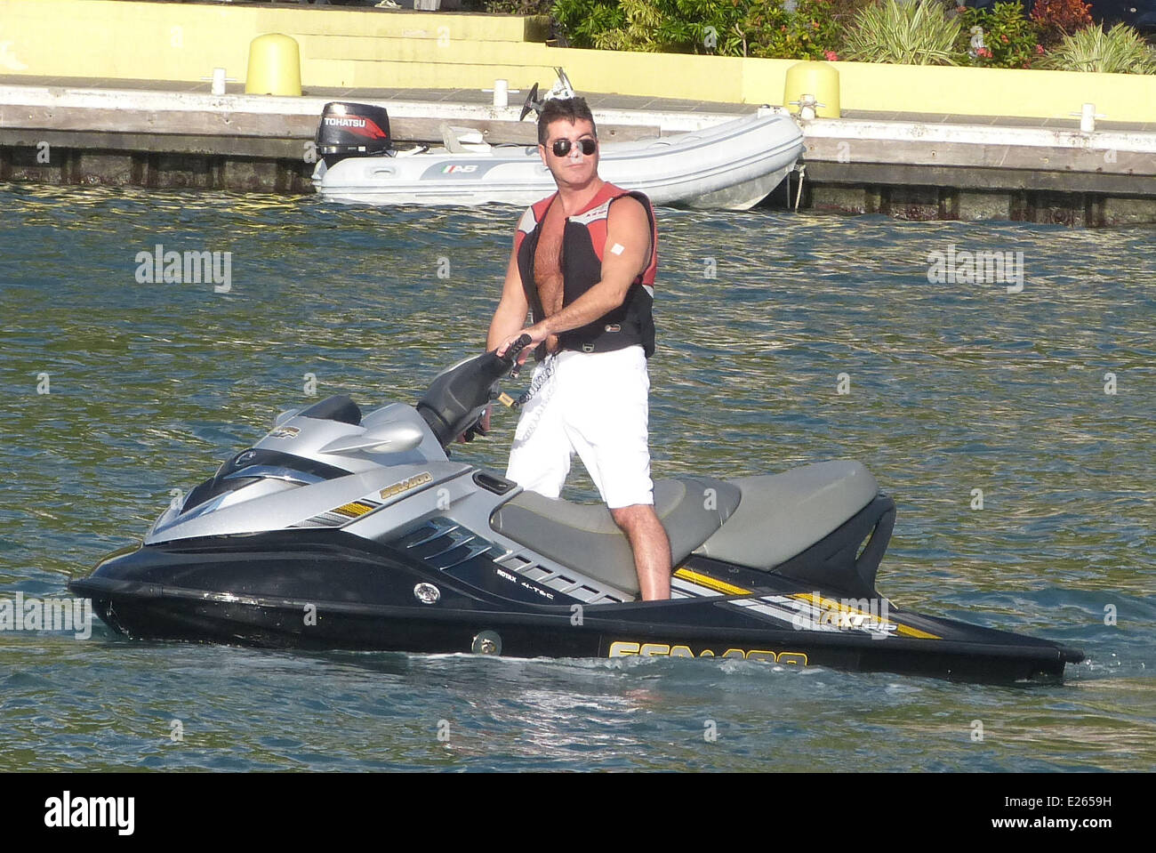 Simon Cowell rides his jet-ski while on holiday in St Barts Featuring ...