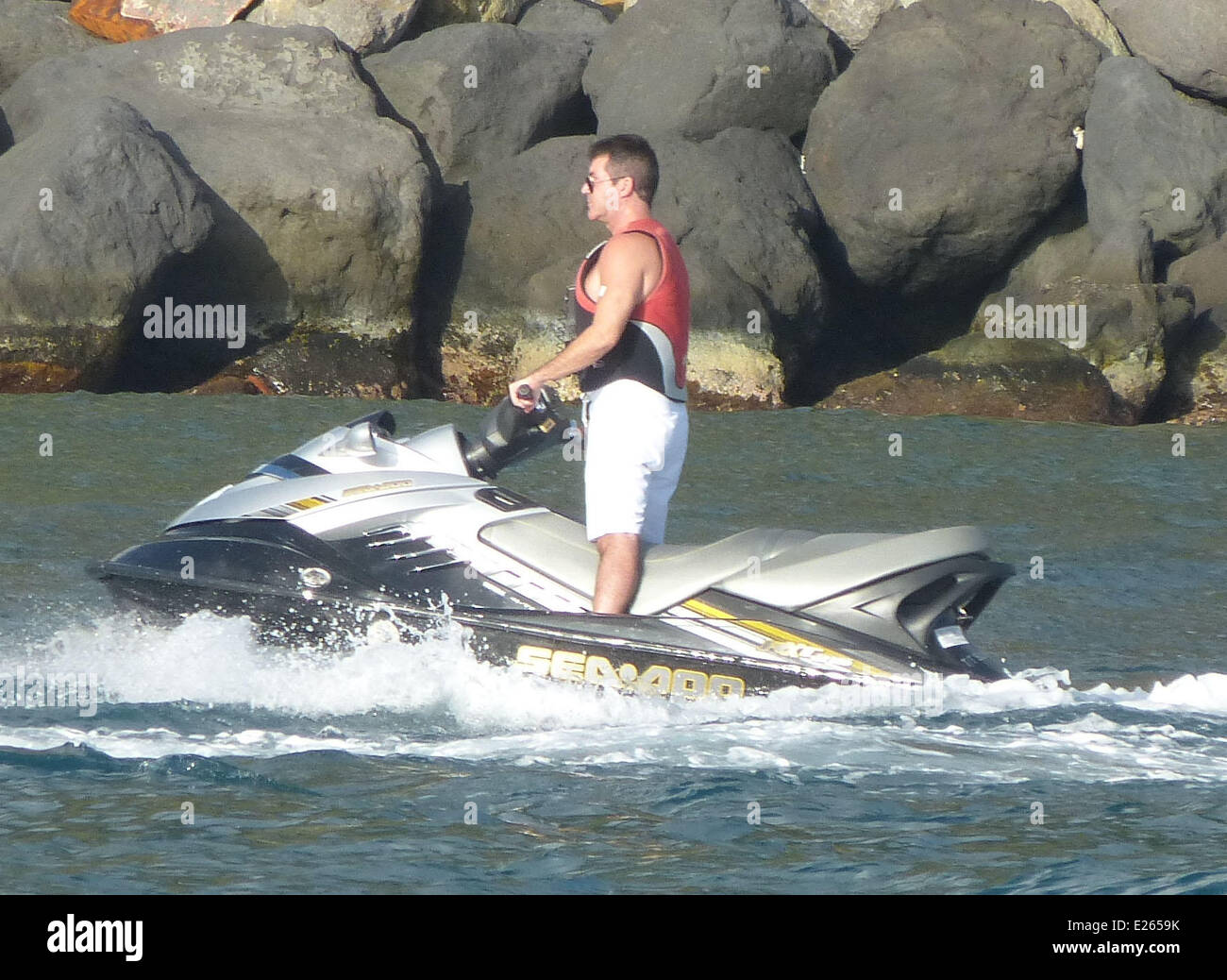 Simon Cowell rides his jet-ski while on holiday in St Barts Featuring ...