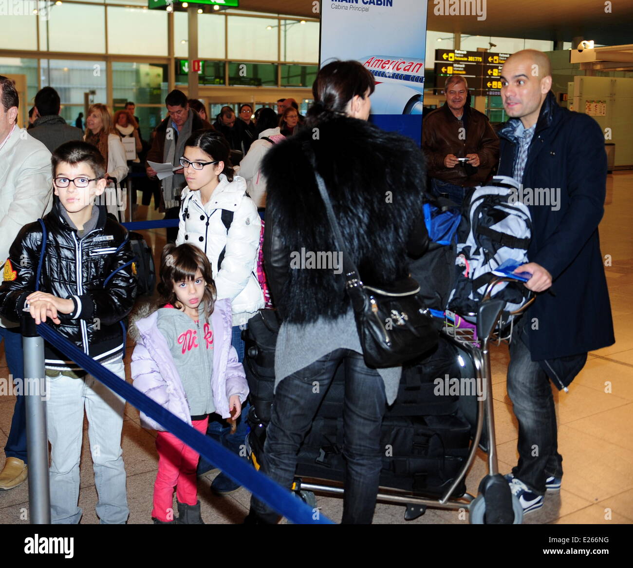 Coach Pep Guardiola and his family in the Barcelona airport to fly to ...