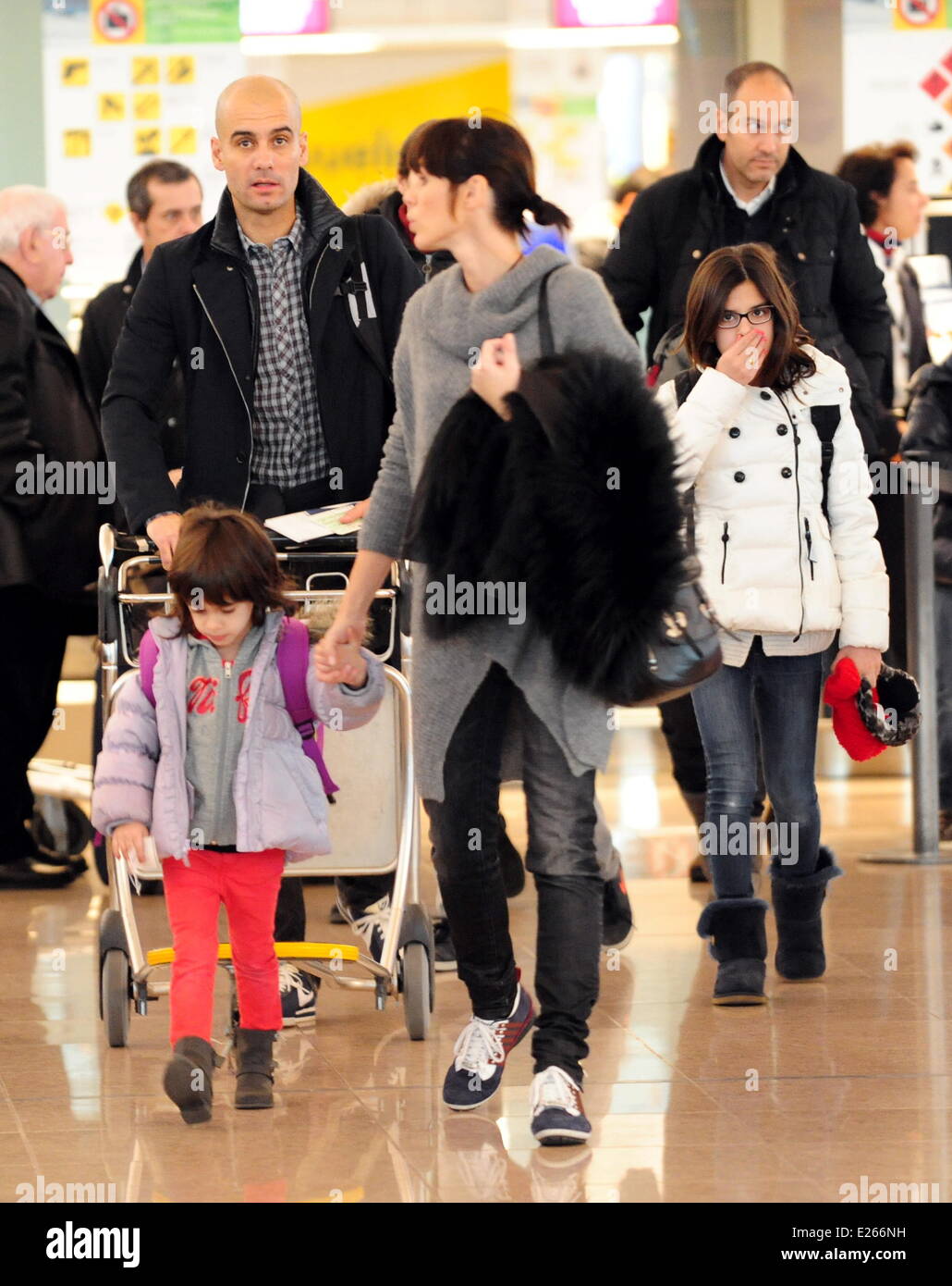 Coach Pep Guardiola and his family in the Barcelona airport to fly to ...