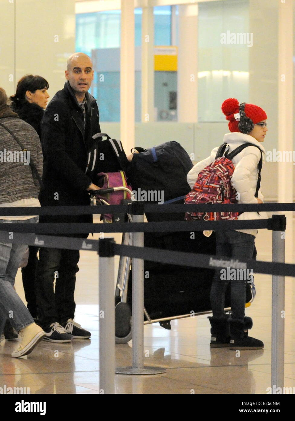 Coach Pep Guardiola and his family in the Barcelona airport to fly to ...