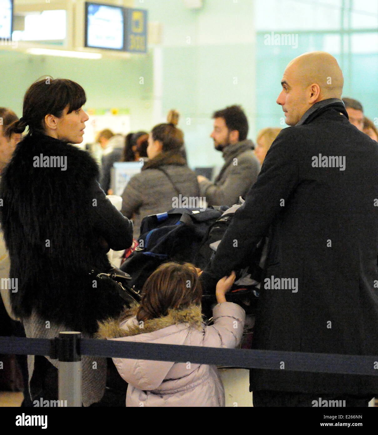 Coach Pep Guardiola and his family in the Barcelona airport to fly to ...