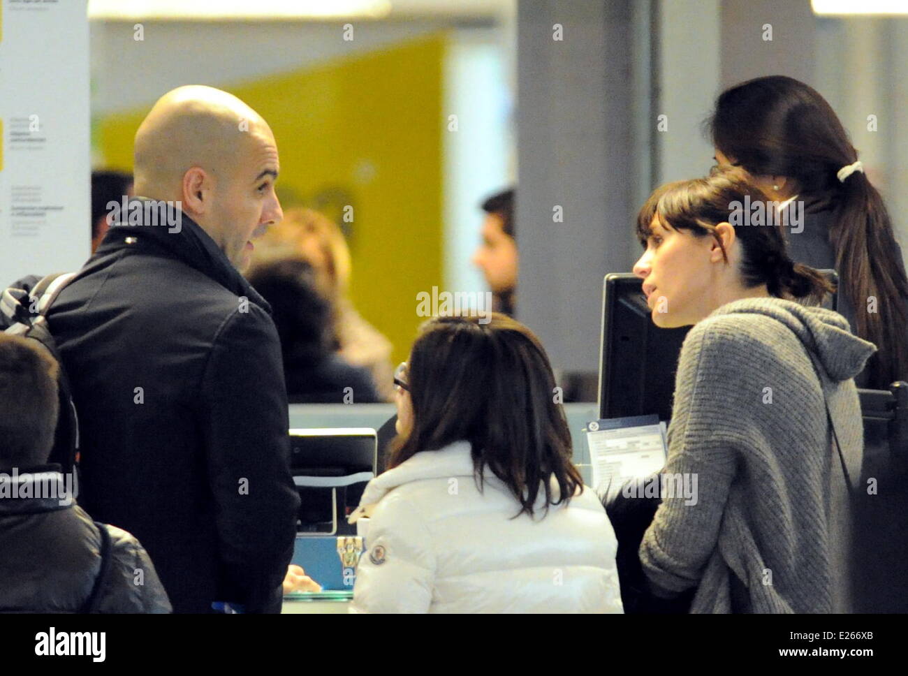 Coach Pep Guardiola and his family in the Barcelona airport to fly to ...