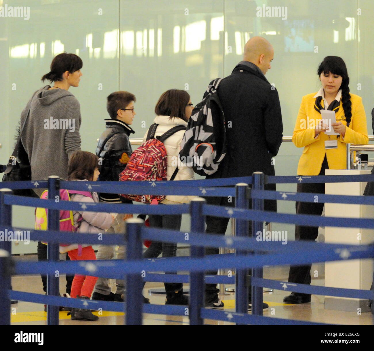 Coach Pep Guardiola and his family in the Barcelona airport to fly to ...
