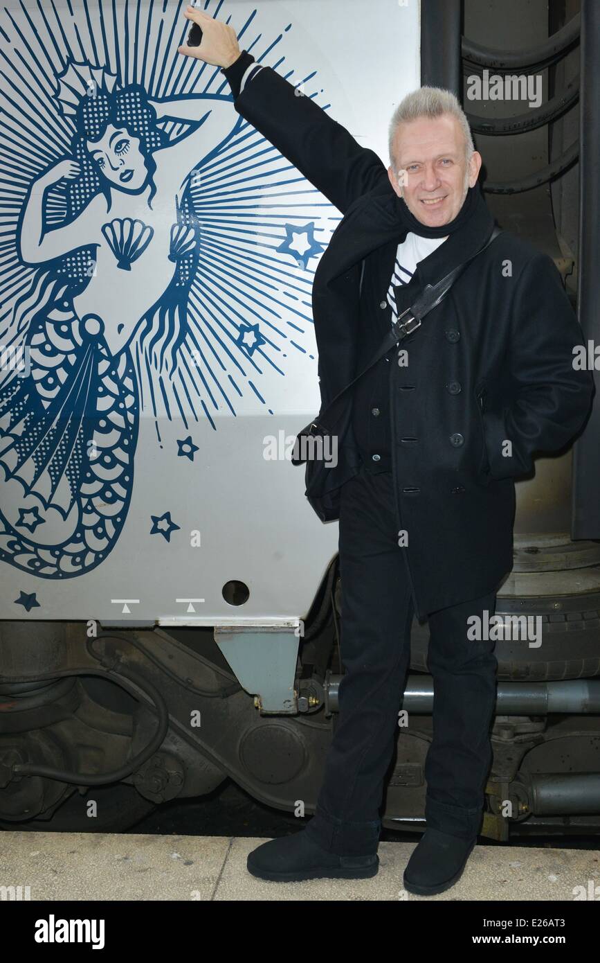 French designer Jean-Paul Gaultier signs a drawing and his autograph on ...