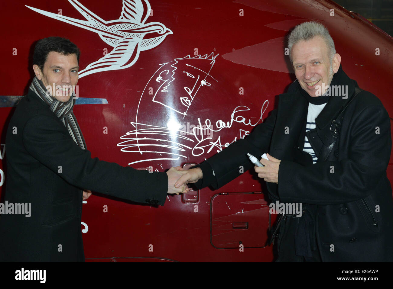 French designer Jean-Paul Gaultier signs a drawing and his autograph on ...