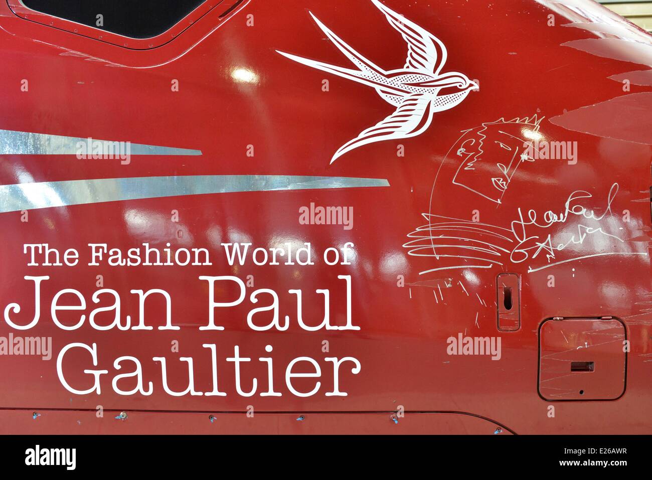 French designer Jean-Paul Gaultier signs a drawing and his autograph on ...