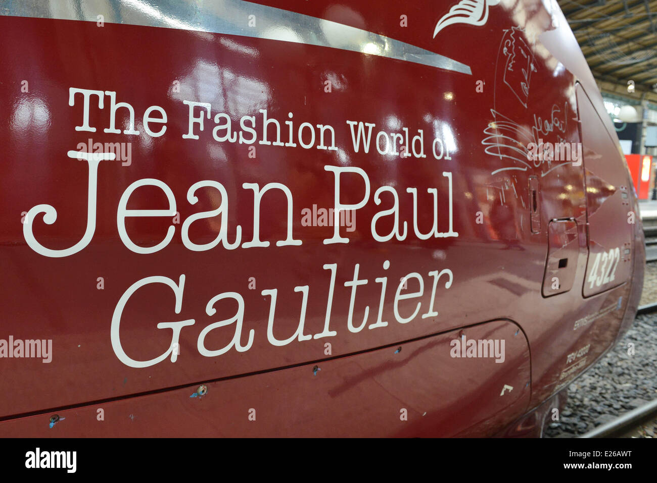 French designer Jean-Paul Gaultier signs a drawing and his autograph on ...