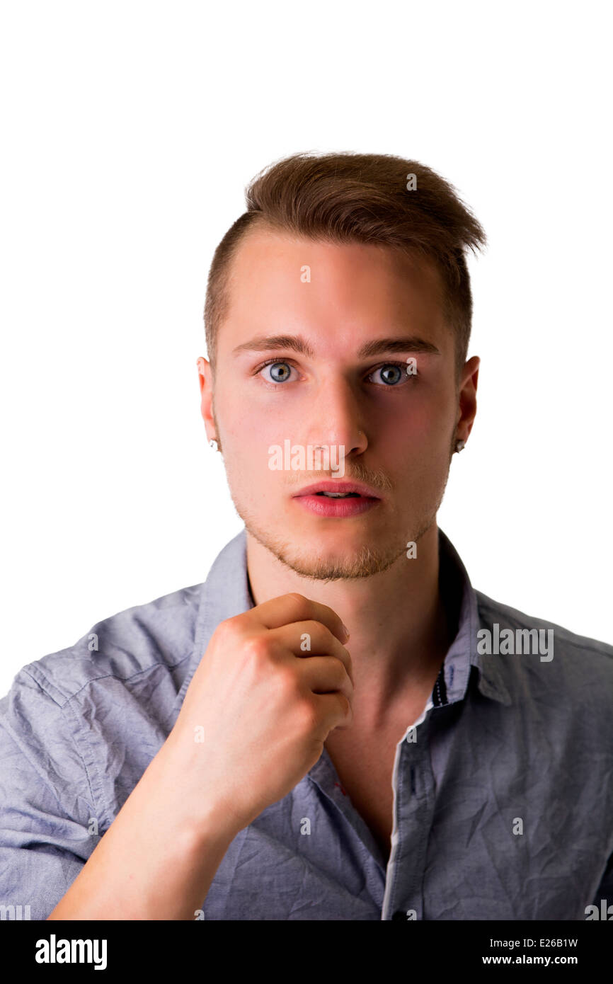 Handsome young man with aggressive, challenging expression, isolated on ...